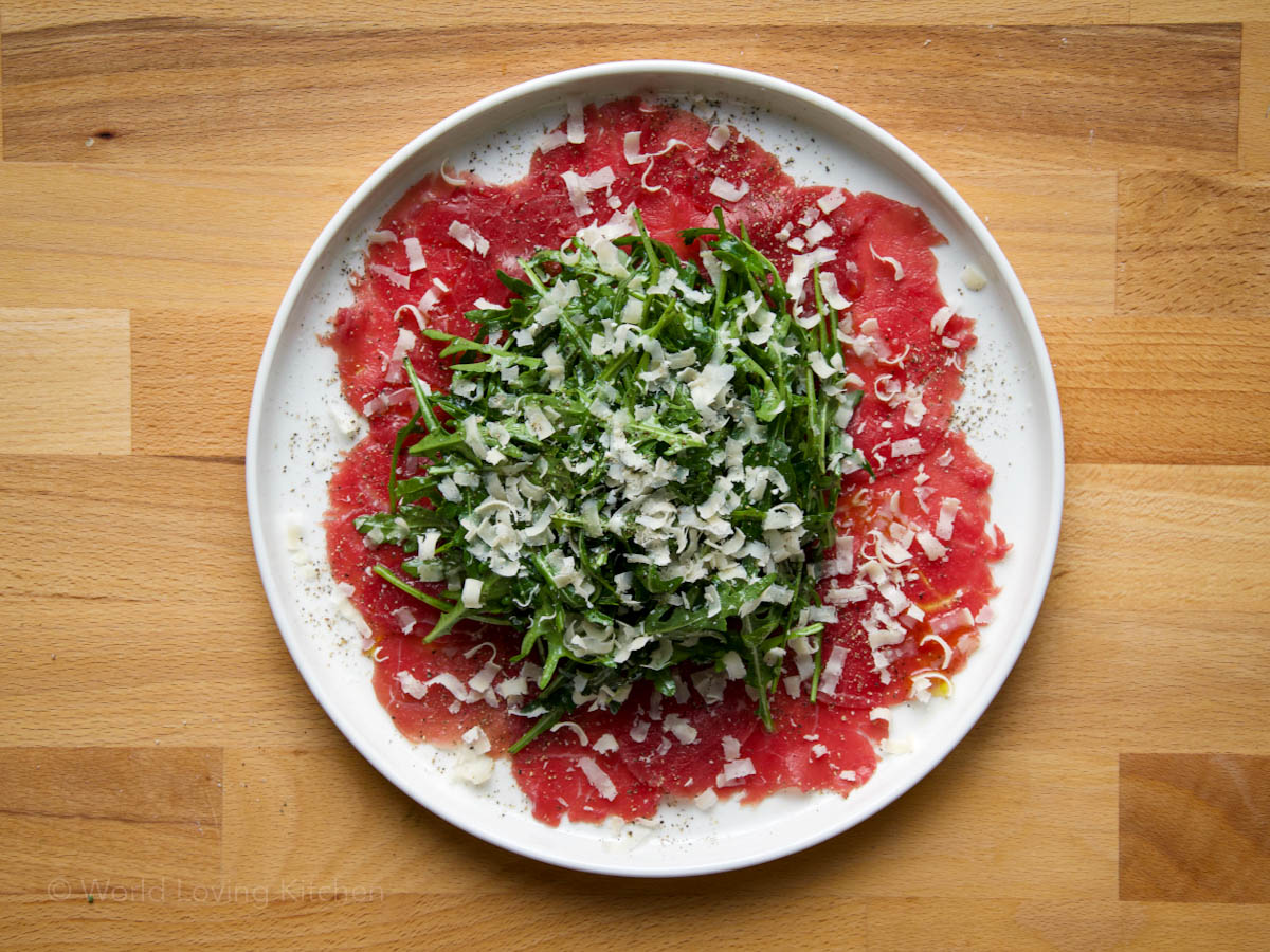 Classic Beef Carpaccio with Arugula Salad and Parmesan Cheese – World ...