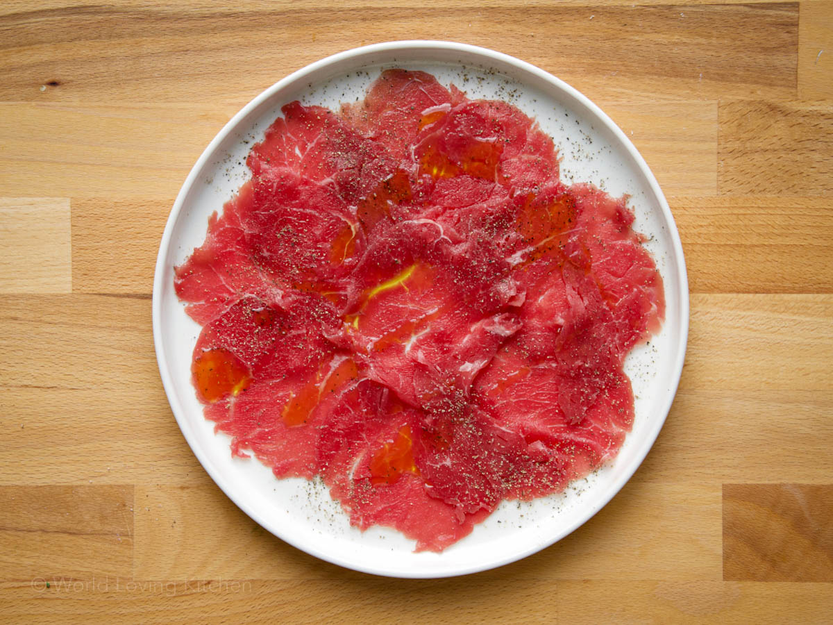 Classic Beef Carpaccio with Arugula Salad and Parmesan Cheese – World ...